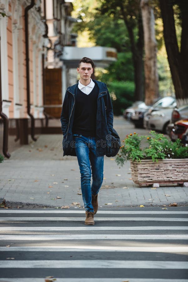 Young man cross the street stock photo. Image of europe - 46805520