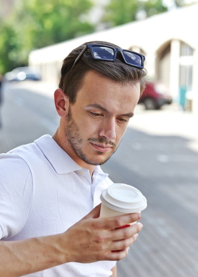 Young Man with Cup of Coffee Stock Photo - Image of male, outside: 43027324