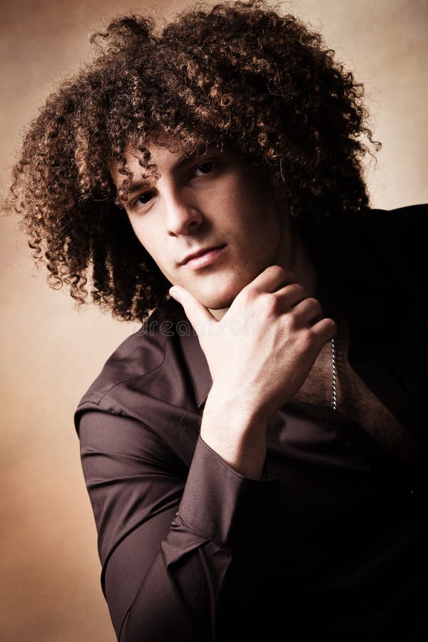 Young man with curly hair stock photo. Image of hairstyle - 19473980 Young man with curly hair stock photo. Image of hairstyle - 19473980