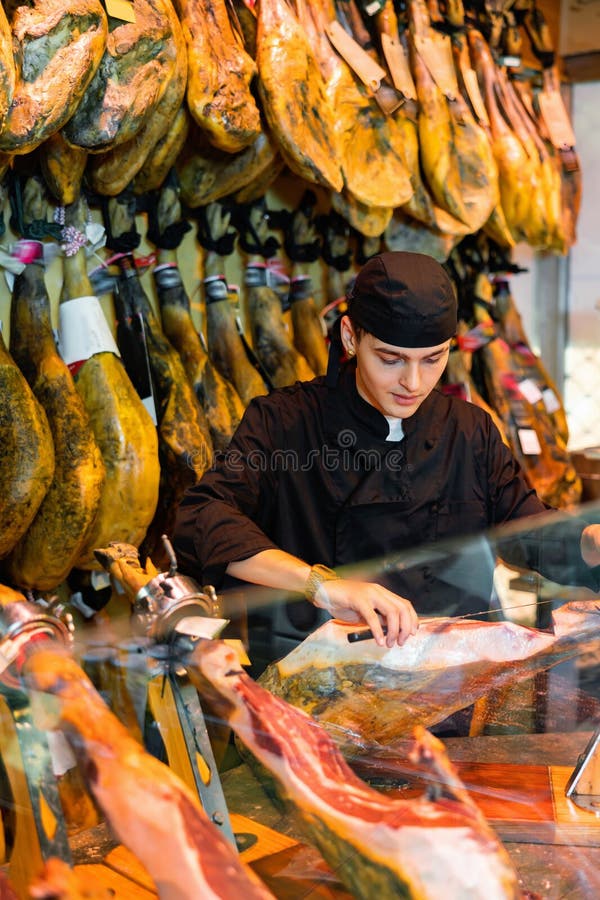 Young Man Cutting Ham in Jamoneria Stock Photo - Image of german, meal ...