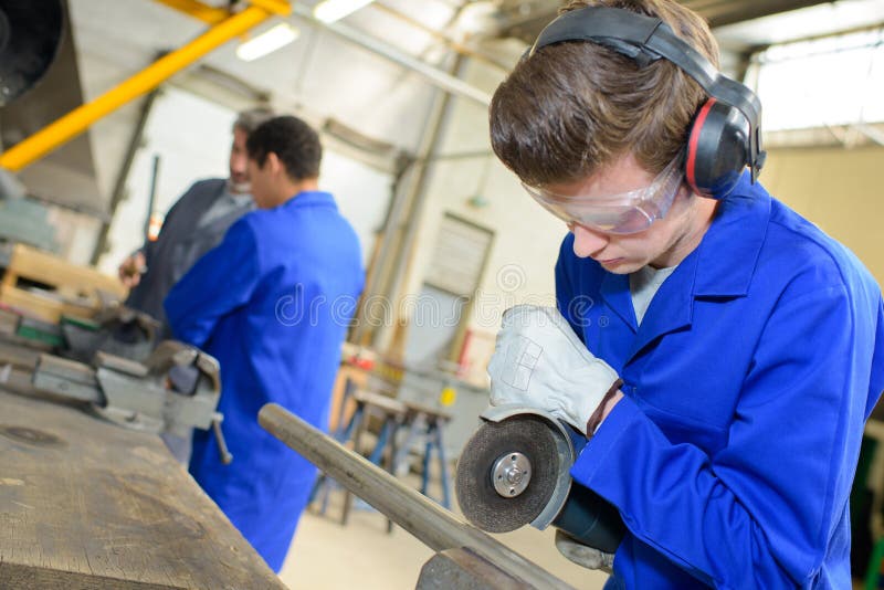 Young man cutting steel stock image. Image of cutter - 315974733