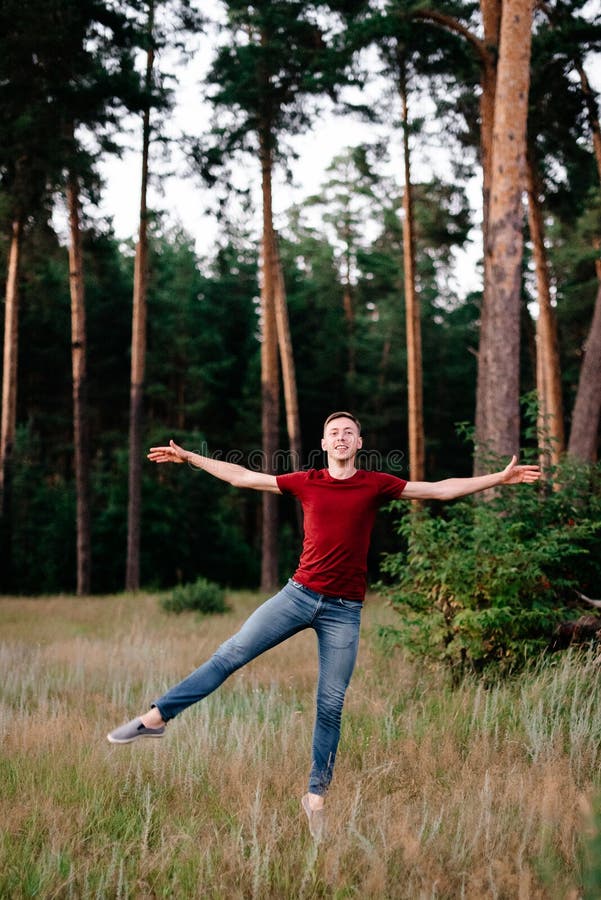 Young Man Dancing in a Pine Forest Stock Photo - Image of park, season ...