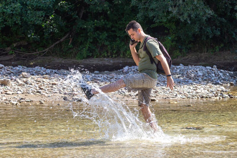A Young Man Taking a Walk on the River Performs Various Types of ...