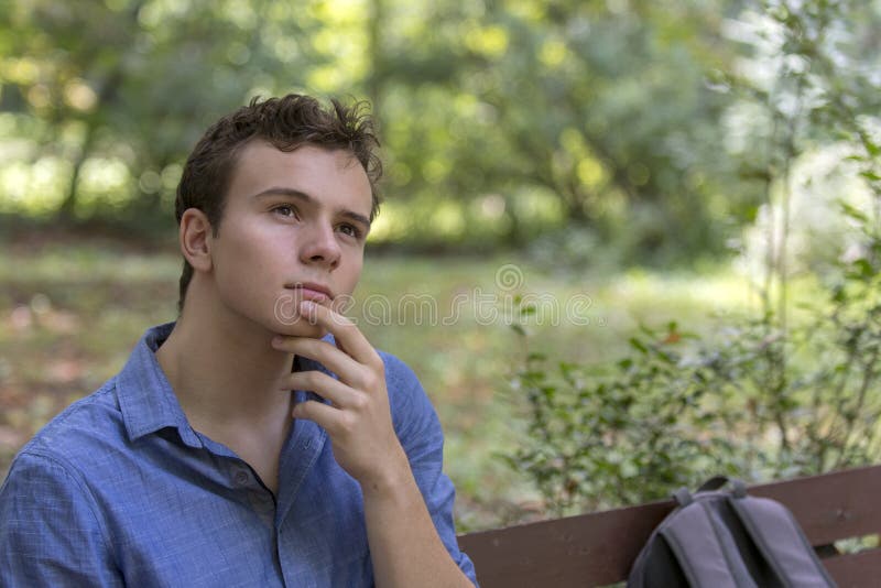Young man daydreaming stock photo. Image of city, thinking - 161249798