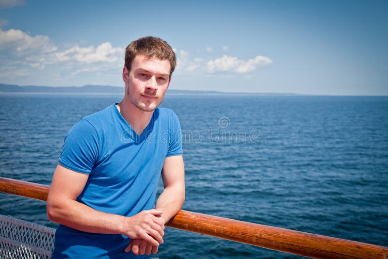 The Young Man on the Deck Against the Sea Stock Image - Image of ...