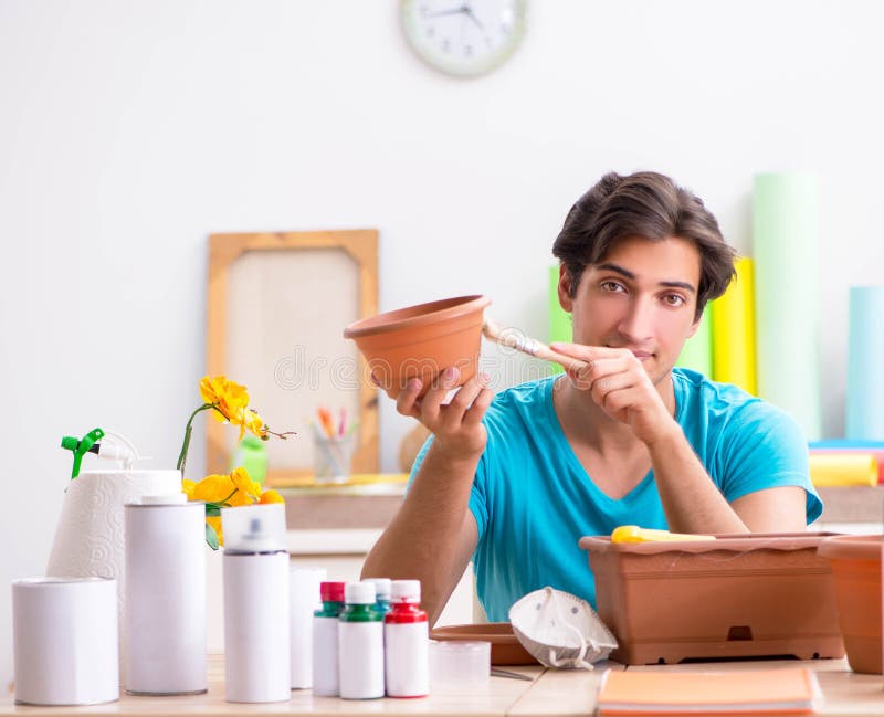 Young Man Decorating Pottery in Class Stock Photo - Image of coloring ...