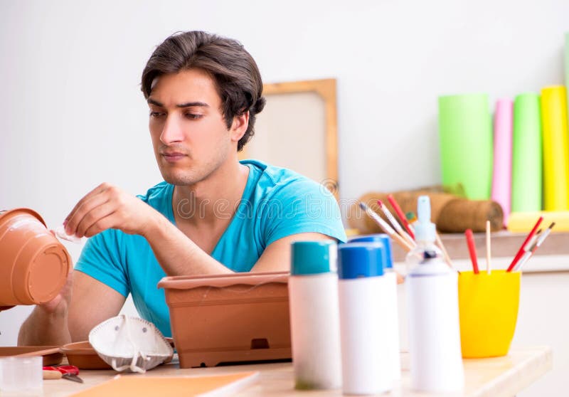 Young Man Decorating Pottery in Class Stock Photo - Image of painting ...
