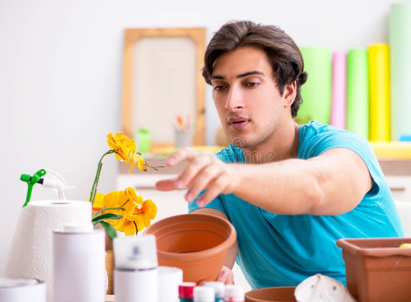 Young Man Decorating Pottery in Class Stock Photo - Image of paintbrush ...