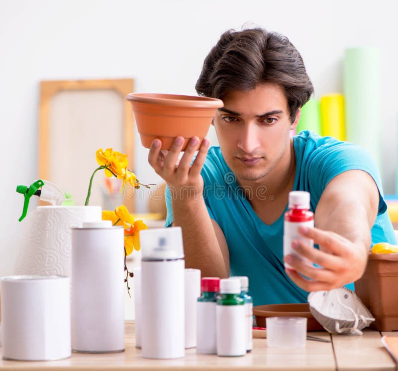 Young Man Decorating Pottery in Class Stock Image - Image of potter ...