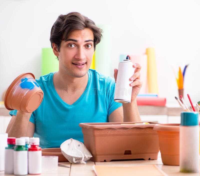 Young Man Decorating Pottery in Class Stock Image - Image of brush ...