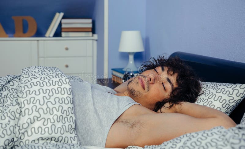 Man Sleeping in Bed at Home Stock Photo - Image of lying, pillow: 180352436