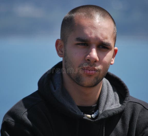 Young Man in Deep Thought stock photo. Image of pondering - 44079090