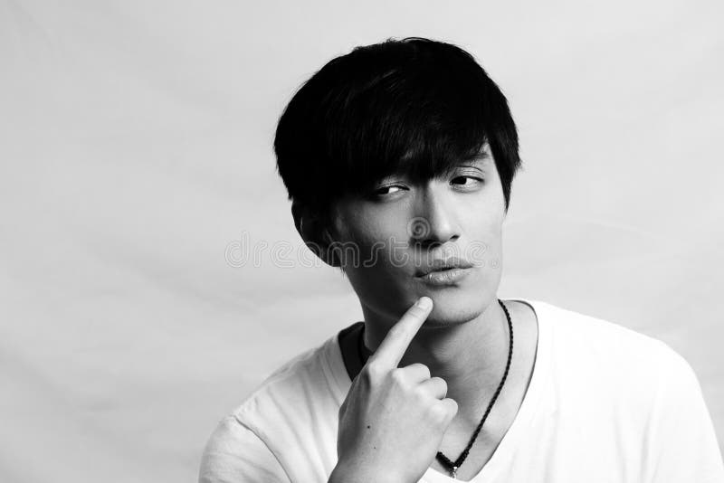 Young man deep in thought stock image. Image of involved - 35314149