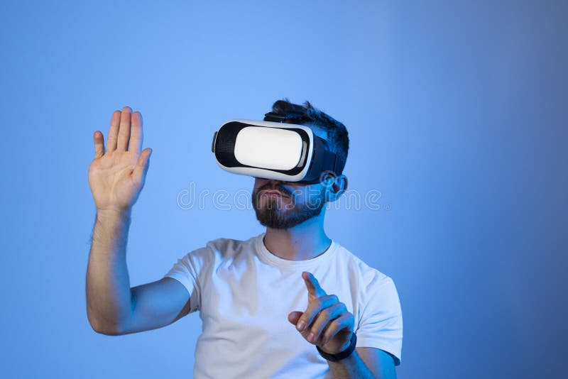 Young Man Developer, Designer or Architect Working with a VR Headset in ...