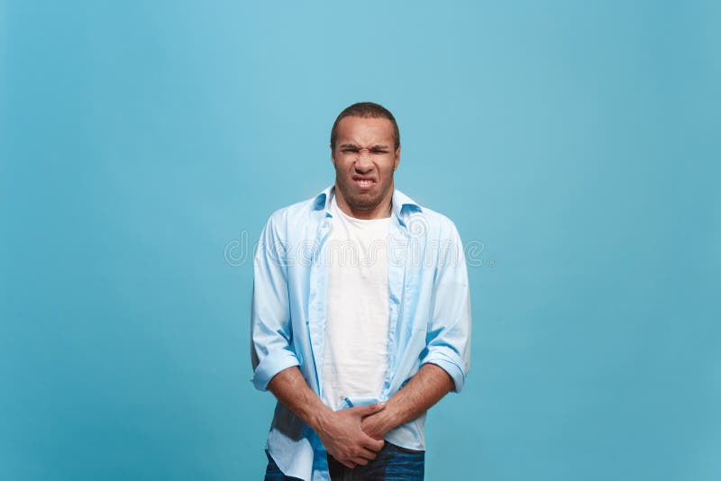 Young Man with Disgusted Expression Repulsing Something, Isolated on ...