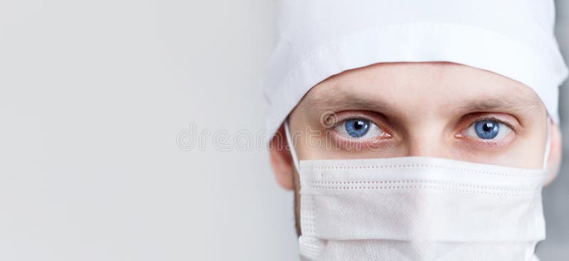Young Man Doctor in Cap and Mask Looks at Camera, Close-up Stock Image ...