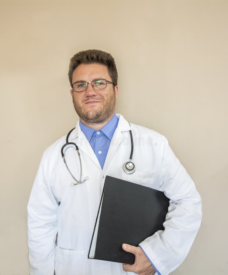 Young man doctor smiling stock photo. Image of doctor - 52514548