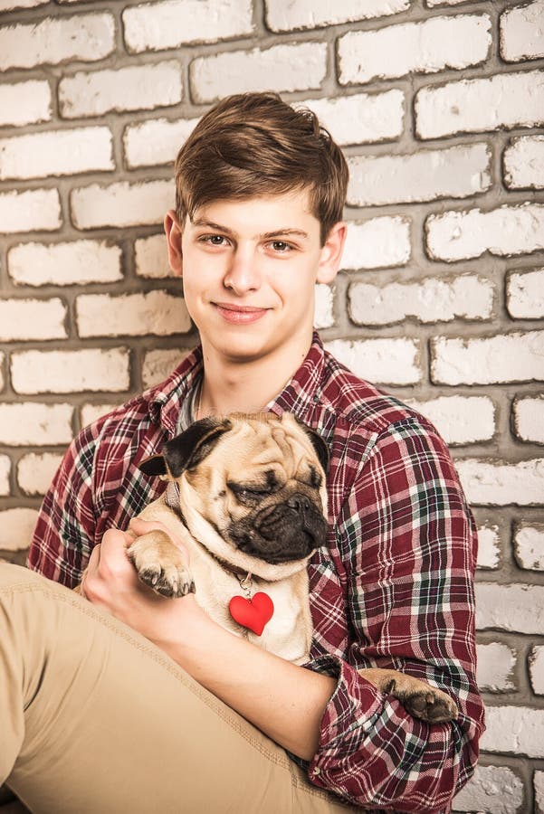 Young man with a dog stock image. Image of leisure, puppy - 48545811