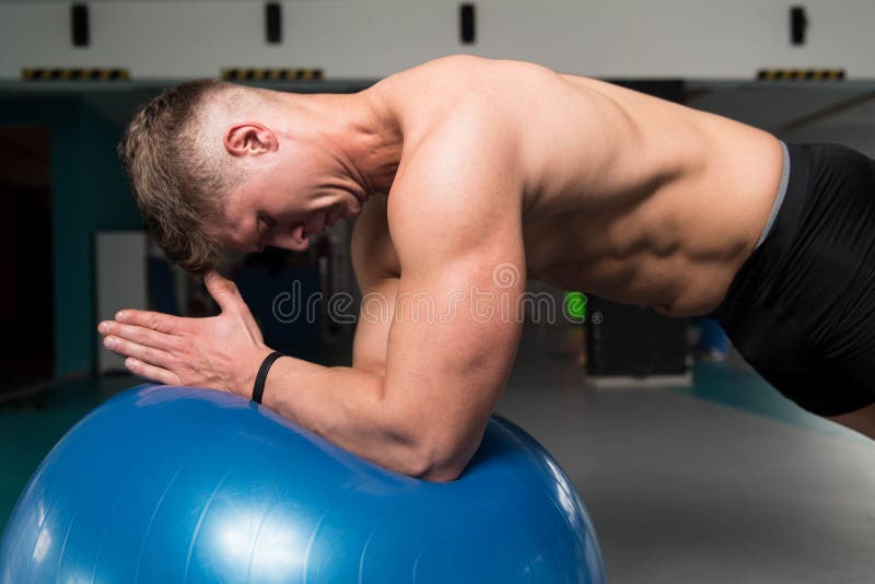 Young Man Doing Abdominal Exercise on Ball Stock Photo - Image of ball ...