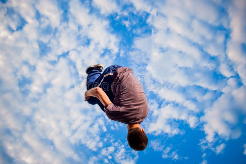 Young Man Doing Backflip Trick in the Air Stock Image - Image of ...