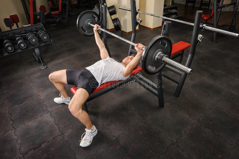 Young Man Doing Bench Press Workout in Gym Stock Image - Image of ...