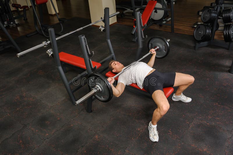 Young Man Doing Bench Press Workout in Gym Stock Image - Image of ...