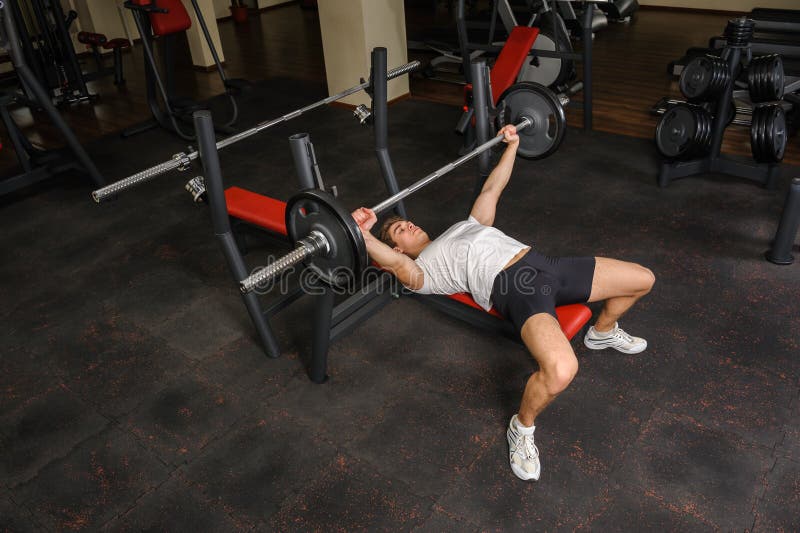 Young Man Doing Barbell Incline Bench Press Workout in Gym Stock Image ...