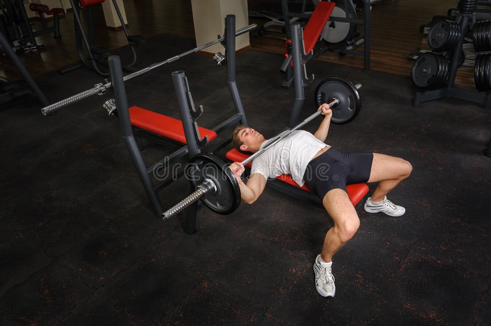Young Man Doing Bench Press Workout in Gym Stock Image - Image of bench ...