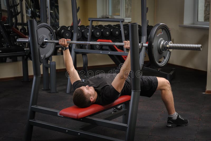 Young Man Doing Bench Press Workout in Gym Stock Image - Image of ...