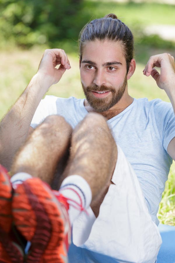 Young Man Doing Crunch Outdoor Stock Photo - Image of body, sporty ...