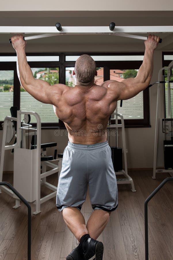 Young Man Doing Exercise for Back Stock Image - Image of adult, energy ...
