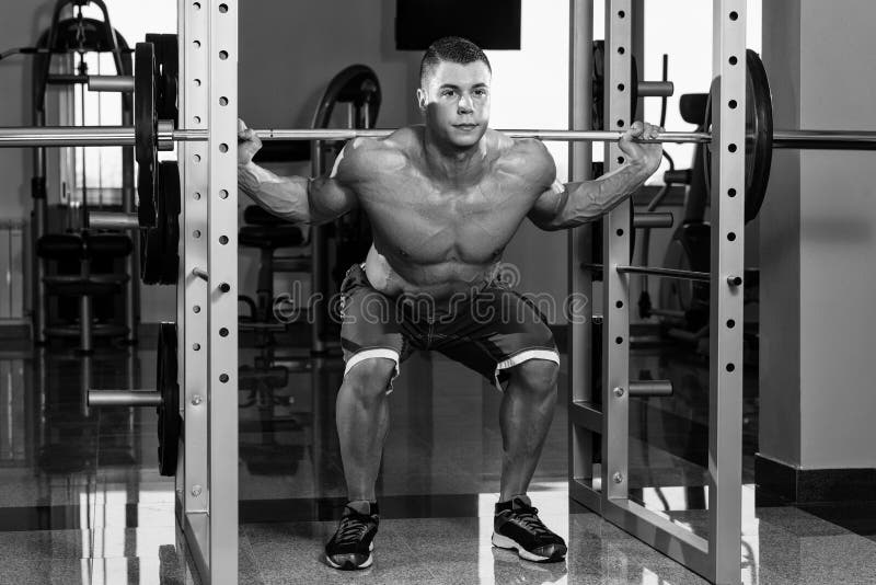 Young Man Doing Exercise Barbell Squat Stock Photo - Image of brown ...