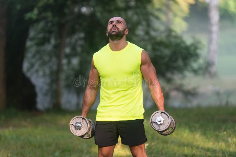 Young Man Doing Exercise for Biceps Outdoors Workout Stock Photo ...