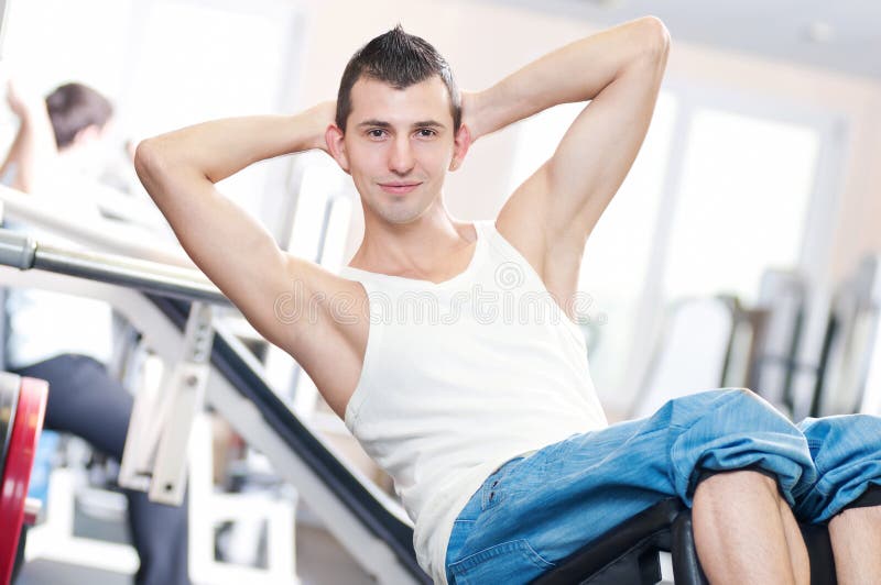 Young Man Doing Exercises at Gym Stock Photo - Image of muscular ...