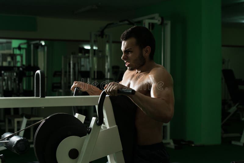 Young Man Doing Heavy Weight Exercise for Back Stock Image - Image of ...