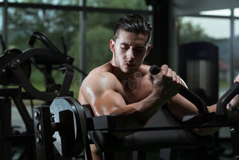 Young Man Doing Heavy Weight Exercise for Biceps Stock Image - Image of ...
