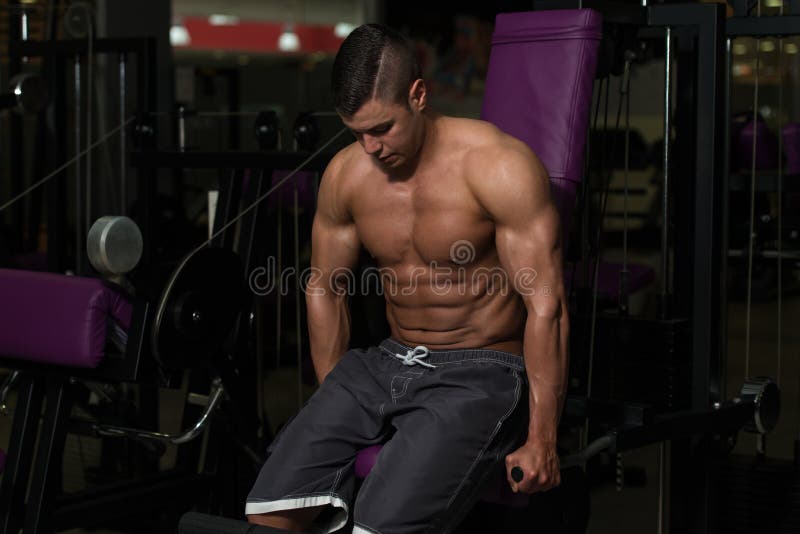 Young Man Doing Heavy Weight Exercise for Triceps Stock Photo - Image ...