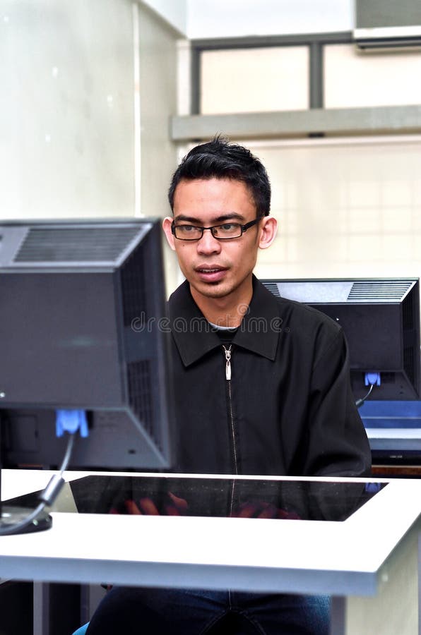 Young man doing his works stock image. Image of lecturer - 31973119