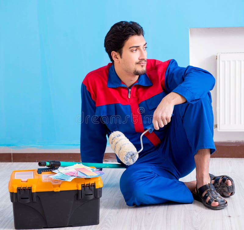 Young Man Doing Home Renovation Stock Photo - Image of matching, blue ...
