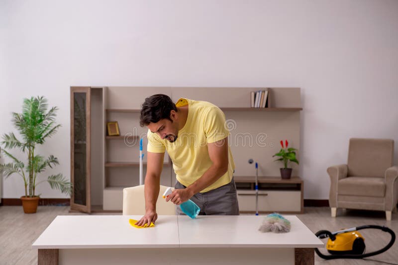 503 Man Dusting Desk Stock Photos - Free & Royalty-Free Stock Photos ...
