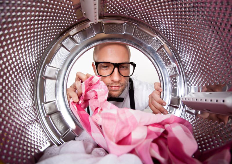 Young man doing laundry stock photo. Image of metal, clean - 39802410