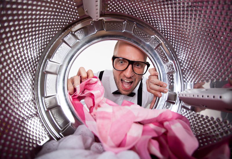 Young man doing laundry stock image. Image of wash, metal - 39802715