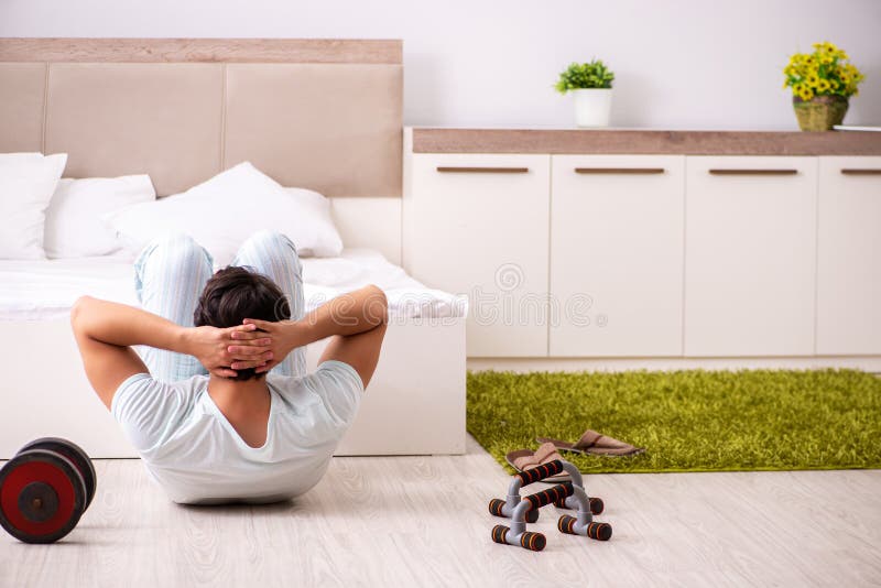 The Young Man Doing Morning Routine in Bedroom Stock Photo - Image of ...