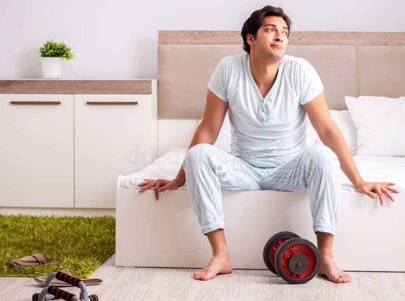 Young Man Doing Morning Routine in Bedroom Stock Photo - Image of ...