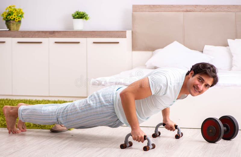 Young Man Doing Morning Routine in Bedroom Stock Image - Image of ...