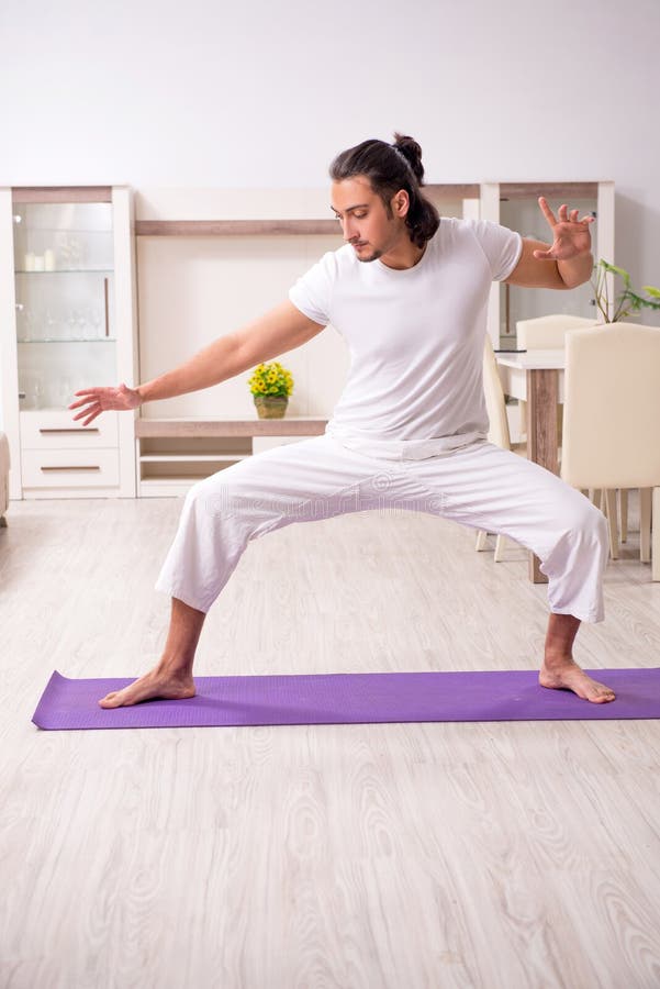 Young Man Doing Physical Exercises at Home Stock Image - Image of house ...