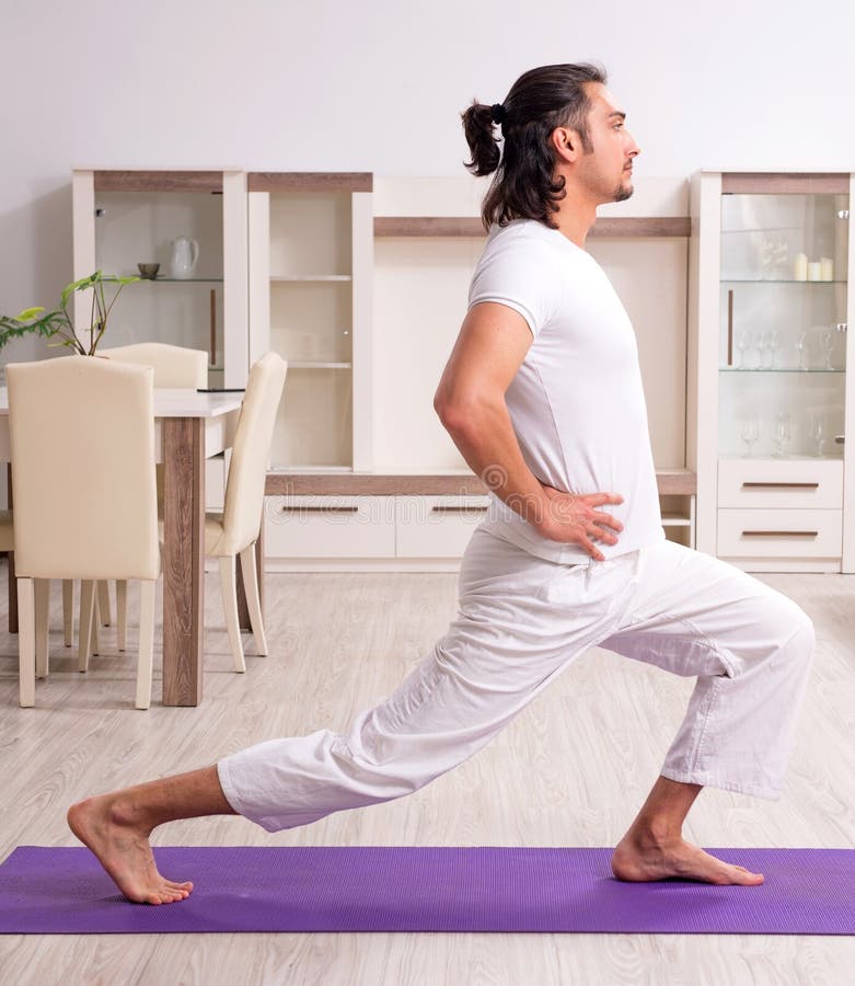 Young Man Doing Physical Exercises at Home Stock Photo - Image of male ...