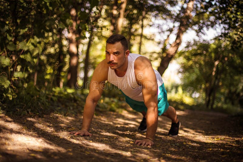 Man Doing Push-up Exercises in the Park Stock Photo - Image of care ...