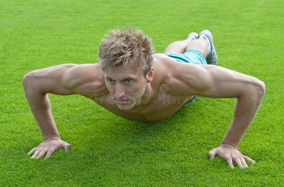Young Man Doing Push-ups on Green Grass Stock Photo - Image of healthy ...