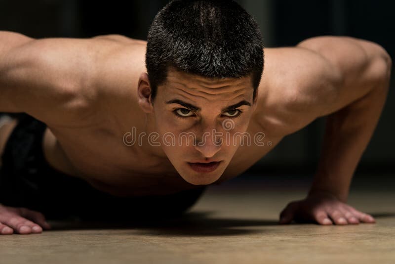 Young Man Doing Pushups stock image. Image of flexing - 38430497